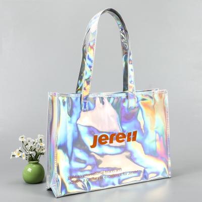 China Custom Plastic Tote Bag With Handles Clear Beach Bags Transparent Stadium Bag Holographic Waterproof Versatile Beach Clear Printed Word Tote Bag Work Handbag Shoulder PVC Tote Shopping Bag for sale