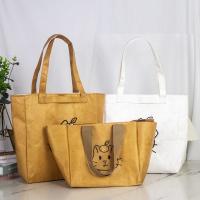 China Recycle Untearable Durable Waterproof Eco-Friendly Punched Tote Tyvek Dupont Kraft Paper Shopping Handbag With Polyester Lining for sale