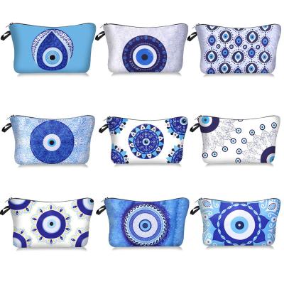 China Manufacturers Wholesale Printed Devil Eye Cosmetic Bag High Quality Waterproof Portable Storage Ladies Large Capacity Clutch Bag for sale