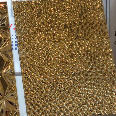 China 316L 304 0.8MM Thickness Mirror Wave Gold PVD Color Hammer Panel for sale