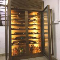 China Custom Rose Gold Stainless Steel Wine Cabinet 220V 50Hz Luxury Villa Display Rack for sale