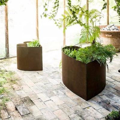 China Large Outdoor Heart Shaped Corten Steel Planter 1100x1070x760mm Garden Ornament for sale