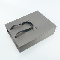 China Custom Coated Kraft Paper Shopping Bags for Clothes Gifts 300gsm with Ribbon Handle for sale