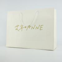 China Custom Kraft Paper Shopping Bags with Logo 80-300gsm Foldable Reusable for sale