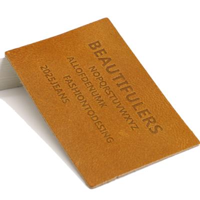 China Molding Hot Press Brown Leather Patches For Hat jeans Clothes for sale