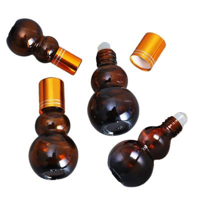 China Calabash Amber Glass Odm Roll On Essential Oil Bottles With Stainless Steel Massage Ball for sale