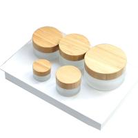 China 50ml / 1.7oz Frosted Glass Cosmetic Cream Jar With Bamboo Lids for sale