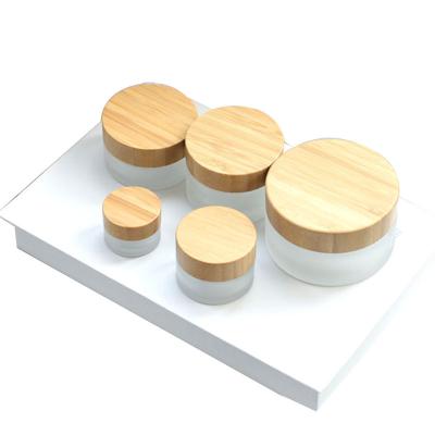 China 50ml / 1.7oz Frosted Glass Cosmetic Cream Jar With Bamboo Lids for sale
