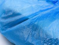 China Light Blue Disposable Shoe Covers Elasticized Seam Fluid Resistant With Textured Tread for sale