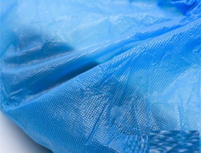 China Light Blue Disposable Shoe Covers Elasticized Seam Fluid Resistant With Textured Tread for sale