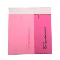China Carton SGS Recycled Kraft Mailers Eco Friendly Pink Double Kraft Paper Bubble Mailers for sale