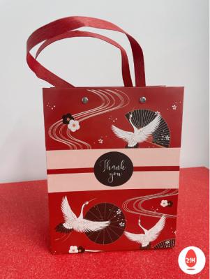 China Cartoon Kraft Paper Gift Packing Bags Custom Printed With Handles for sale