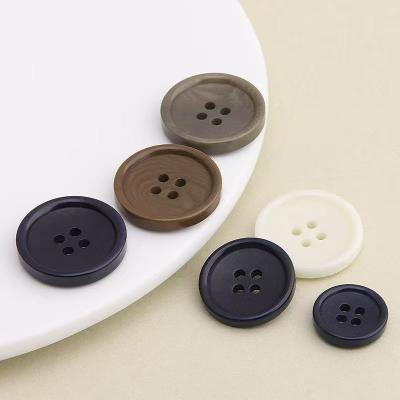 China Customizable Corozo Suit Buttons with Subtle Wood-Grain Patterns and 4-Hole Design for sale