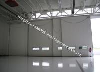 China Multi Sector Structural Folded Hinged Sliding Doors Bottom Rolling Hangar Door Smart Track Design for sale