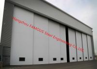 China Multi Sector Structural Folded Hinged Sliding Doors Bottom Rolling Hangar Door Smart Track Design for sale