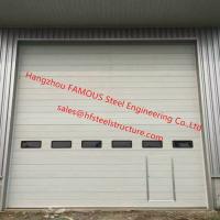 China Full Vertical Lift Door Motorized Industrial Garage Doors With Transparent Windows And Pedestrian Access for sale