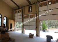 China Full Vertical Lift Door Motorized Industrial Garage Doors With Transparent Windows And Pedestrian Access for sale
