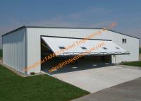 China Vertical Bi-Fold Hangar Door System with 6-9 M/min Opening Speed and 700+ Pa Wind Load Capacity for sale