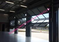 China Aluminum Frame Glass Industrial Garege Doors Vertical Rising Bi Fold Door With Remote Control for sale