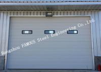 China Frequency Controlled Vertical Lifting Fabric Industrial Doors For Large Openings for sale