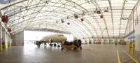 China Prefabricated Steel Pipe Truss Aircraft Hangar Building - 100m Clear Span, Hurricane-Resistant Design for sale