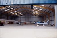 China Easy Expansion Aircraft Hangar Buildings - Up to 100m Clear Span Width with Hurricane-Resistant Steel Construction for sale
