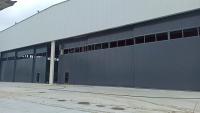 China Engineered Unidirectional Aeronautical Hangar Door Typical Design With Wicket for sale