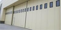 China Engineered Unidirectional Aeronautical Hangar Door Typical Design With Wicket for sale