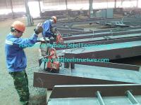 China Pre Engineering Commercial Steel Buildings H Section Beam Coated Grey Painting for sale
