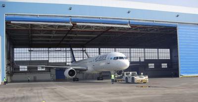China Single Bay PEB Steel Aircraft Hangar with Electrical Roll-up Doors - H-Style Steel Frame & Custom Panel Options for sale