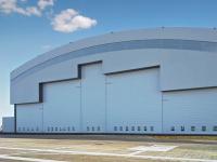 China Prefab Curved Roof Steel Aircraft Hangar with Electrical Sliding Doors - H-Style Steel Frame & Custom Door Options for sale