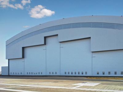 China Prefab Curved Roof Steel Aircraft Hangar with Electrical Sliding Doors - H-Style Steel Frame & Custom Door Options for sale