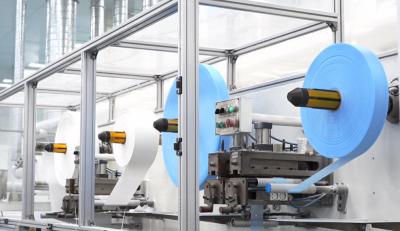 China Full Servo Control Sanitary Napkin Making Machine 850 Stitches per Minute for sale