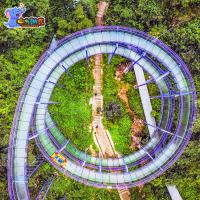 China Custom Glass Water Slide 250m Spiral Outdoor Amusement Equipment for Mountain Parks for sale