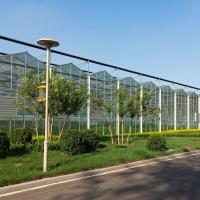China Large Prefabricated Outdoor And Indoor Backyard  Glass Greenhouse For Flower Growing for sale