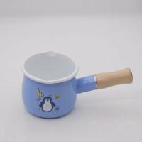 China Pastel Blue Cute Penguin Print Enamel Milk Pot With Wooden Heatproof Handle Small Enamel Saucepan For Heating Milk Baby Food for sale