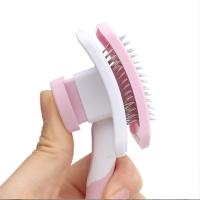 China Pink Dog Self Cleaning Pet Grooming Brush Automatic Cat Hair Removal Comb for sale