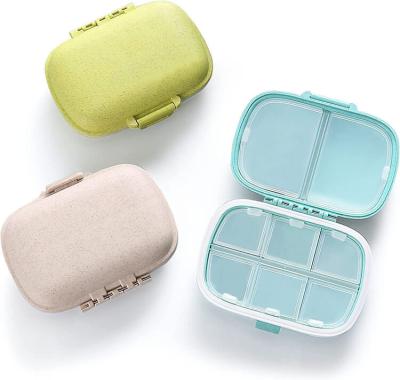 China Custom Weekly Wheat Straw Pill Dispenser 7 Day Pill Box 8 Compartments Portable Medicine Organizer for sale