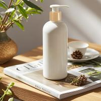 China Hot Sale Shea Butter Whitening Body Lotion Plastic Dispenser Face Lotion Pump Bottle with Bamboo Pump for sale