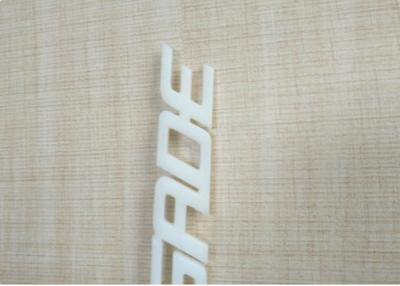 China White / Ivory Automotive Plastic Injection Molding Custom Vehicle Logos Sub Gate Type for sale