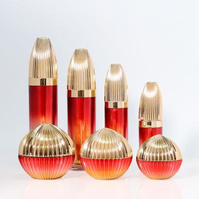 China Red Gold Gradient Plastic Cosmetic Bottles 50g Cream Jar Sphere Shape Acrylic Collar Material for sale