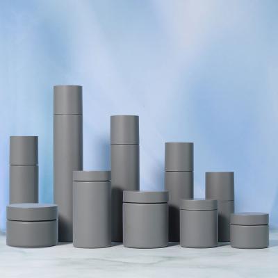 China Cylinder Round Plastic Bottles 60ml 100ml 120ml Gray Cylinder Bottles With Caps for sale