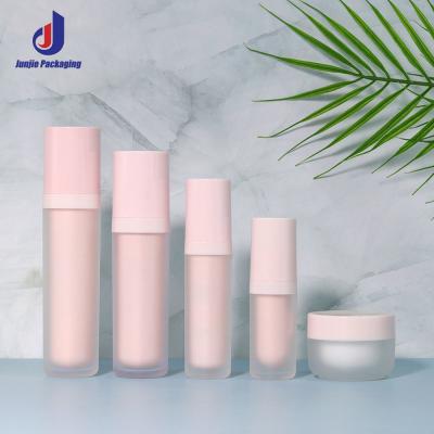 China Luxury Double-wall Lotion Cream Pump Bottle Pink Acrylic Plastic Face Cream Essence Bottle Acrylic Eye Essence Cream Bottle Set for sale