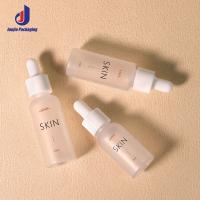 China 1oz 30ml PET Plastic Bottle Luxury Push Button Dropper Bottle Clear Scrub For Serum And Lotion for sale