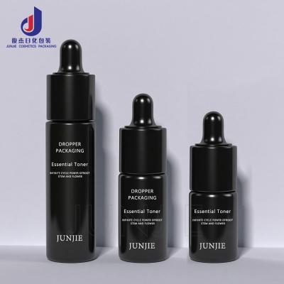 China Customized logo Luxury Plastic Skincare Packaging 20ml 30ml 60ml 1oz Frosted Flat Face Serum Essential Oil Dropper Black Bottle for sale