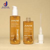 China 200ml 250ml PET Cosmetic Bottles Flat Shoulder Round Bottom Shape with Press Lotion Pump for Hair Conditioner, Makeup Remover for sale