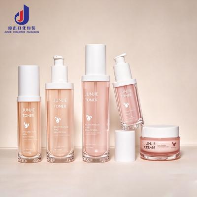 China Cosmetics Packaging Sets Acrylic Jar and Plastic Bottle Custom Clear Polygon Body with Lids for Cream Skin Care Products for sale