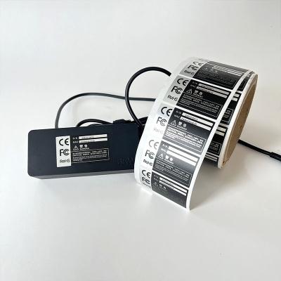 China Custom Printing Logo Waterproof Silver Paper Electric Product LED Label Sticker Vinyl Laptop Charger Sticker Logo Roll for sale