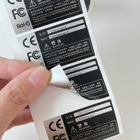 China Custom Printing Logo Waterproof Silver Paper Electric Product LED Label Sticker Vinyl Laptop Charger Sticker Logo Roll for sale