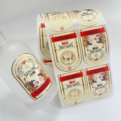 China Custom Printing Texture Gold Foil Embossed Sticker Perfume UV Logo Label Printing Wine Label for sale